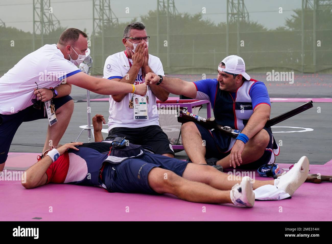 Silver medalist David Kostelecky, laying left, and gold medalist Jiri ...