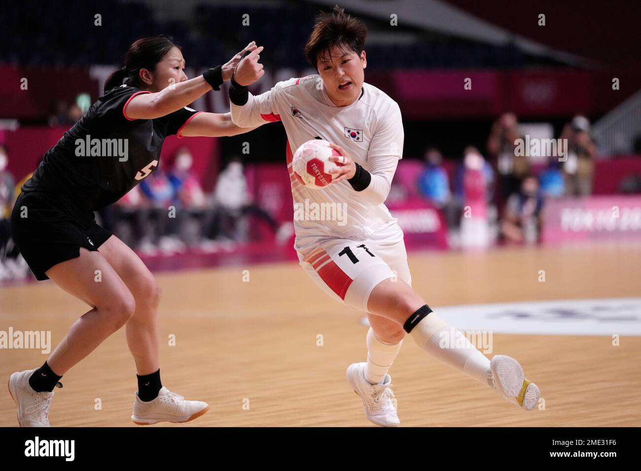 South Korea's Ein Hee Ryu, right, and Japan's Sayo Shiota challenge for ...