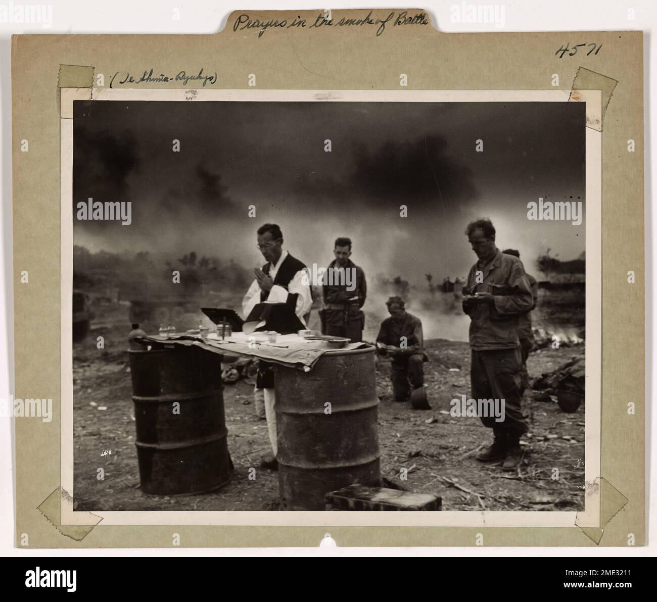 Prayers in the Smoke of Battle. On Ie Shima, a chaplain leads a service ...