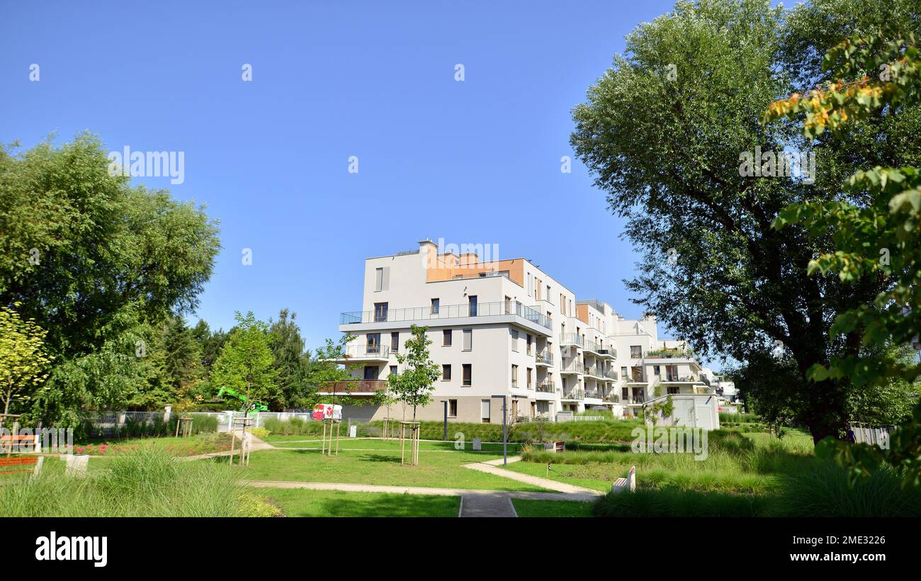 Modern residential building with new apartments in a green residential ...