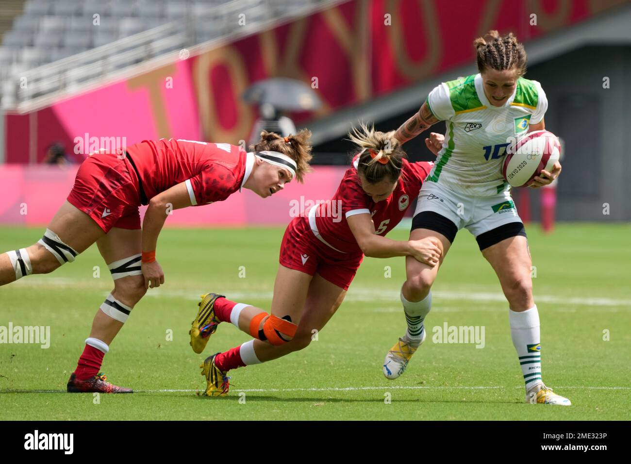 Brazil's Raquel Kochhann, right, is tackled by Britain's Deborah ...