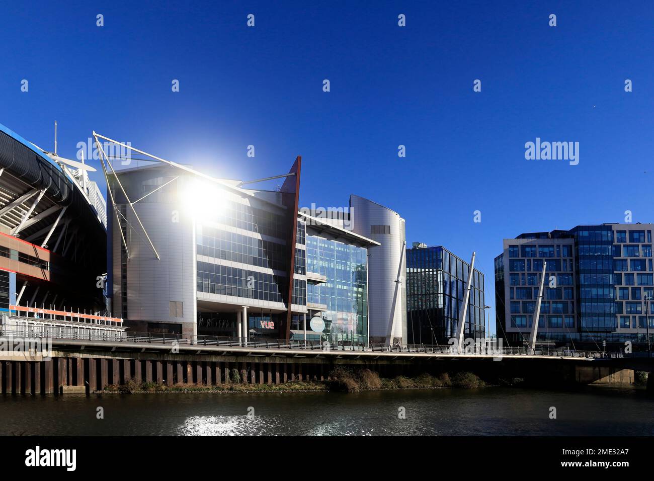 Sun flare off the Vue Cinema building and waterfront scene, river Taff ...
