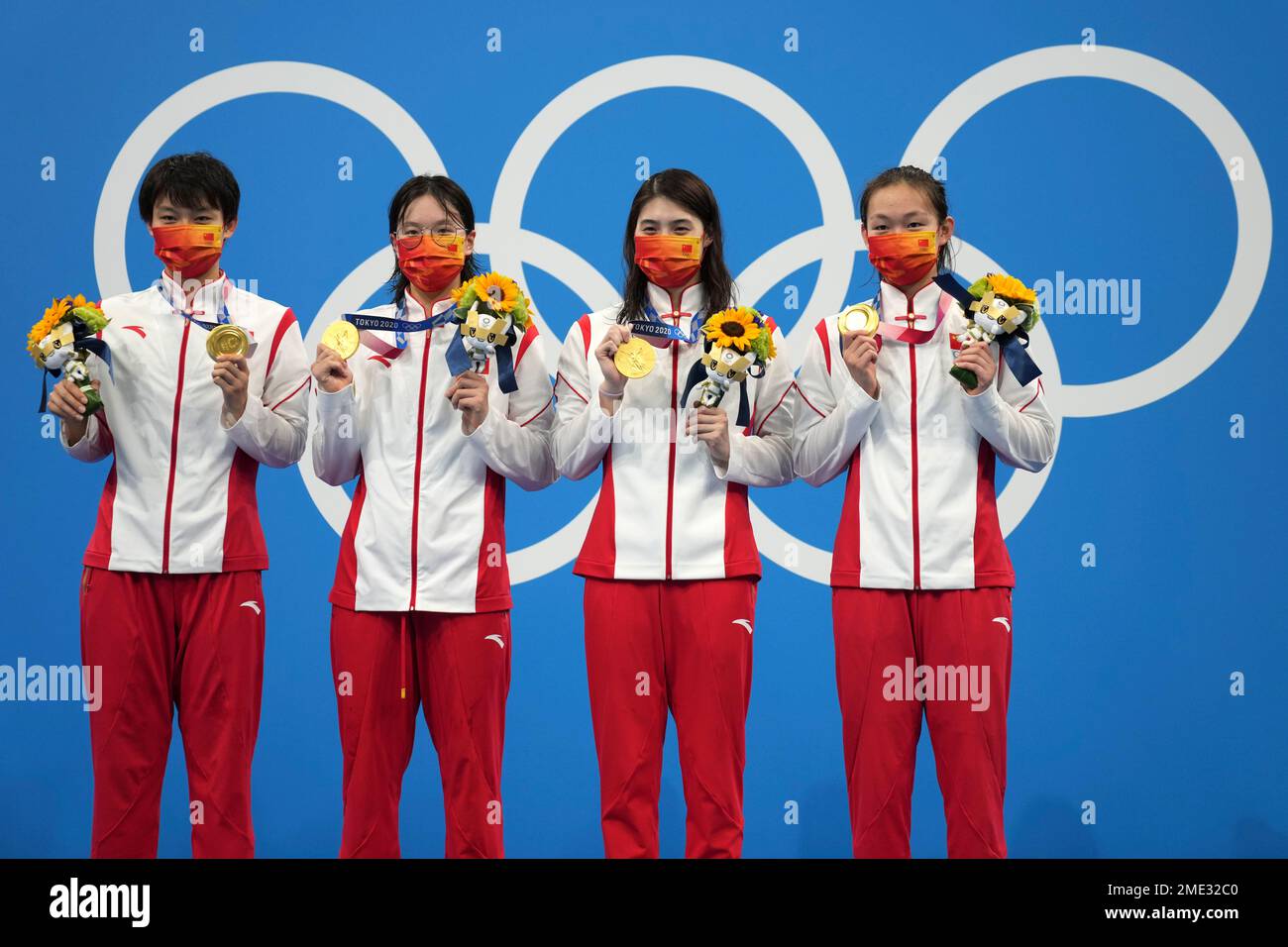 China's women's 4x200-meter freestyle relay team, from left, Yang ...