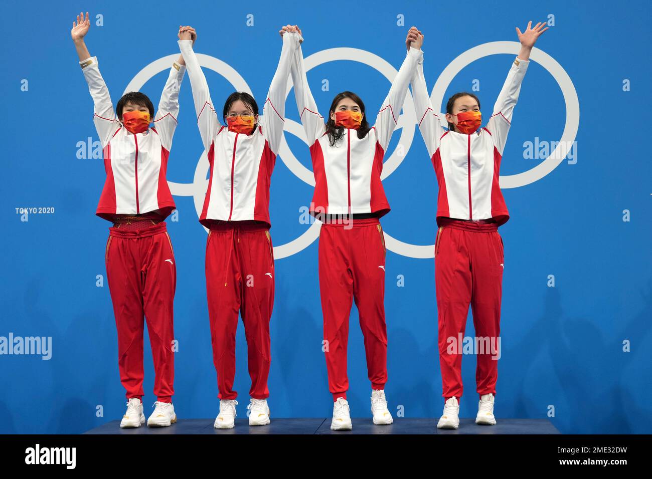 China's women's 4x200-meter freestyle relay team, from left, Yang Junxuan, Tang Muhan, Zhang ...