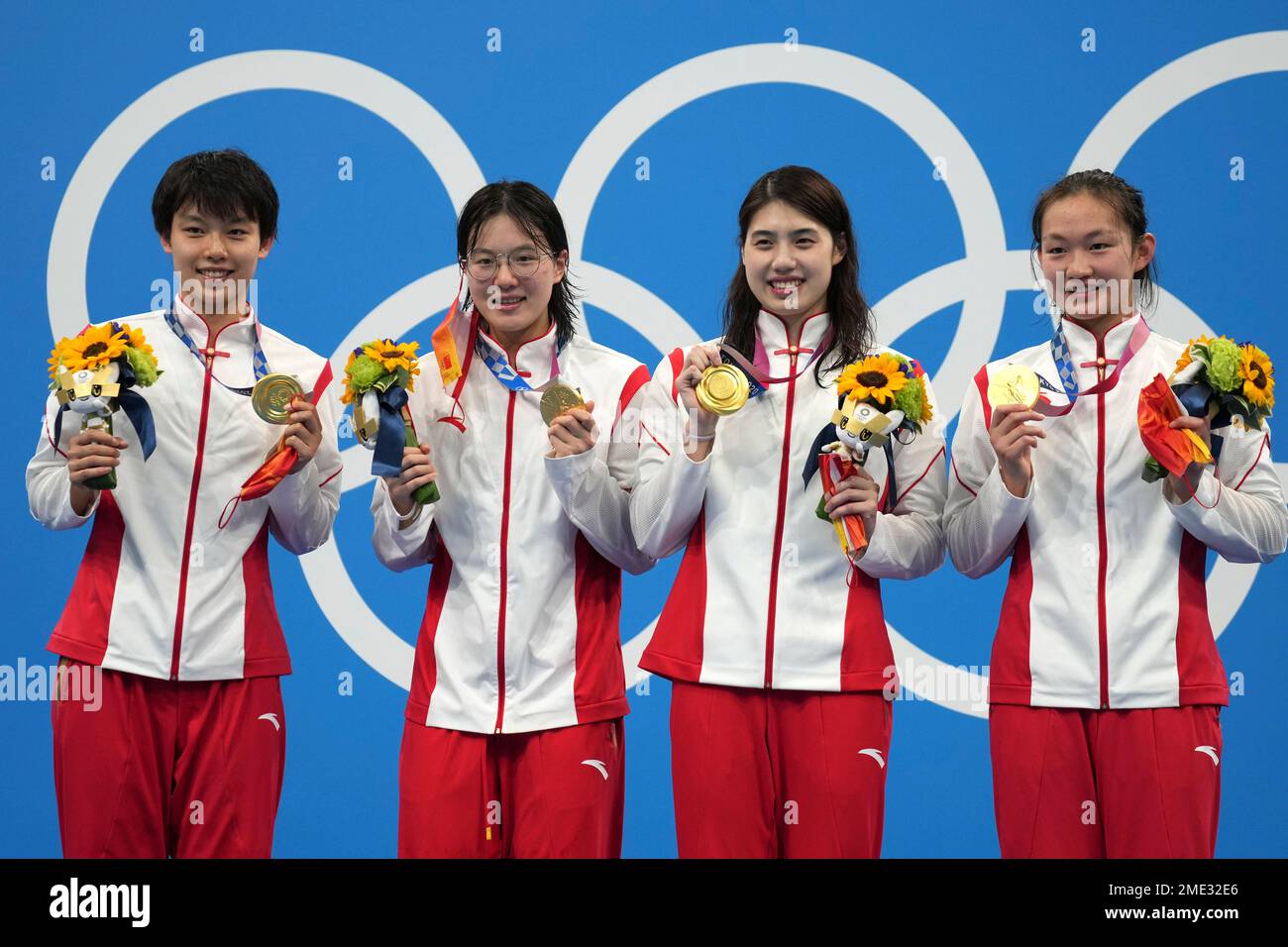 China's women's 4x200-meter freestyle relay team, from left, Yang ...