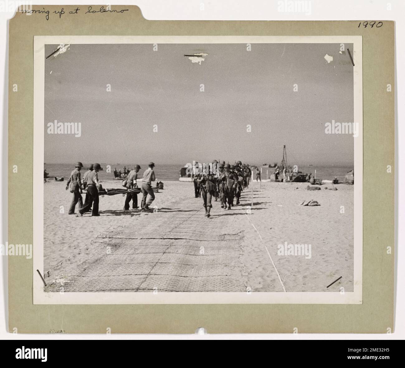 A Coast Guard combat photographer captures U.S. troops marching up the ...