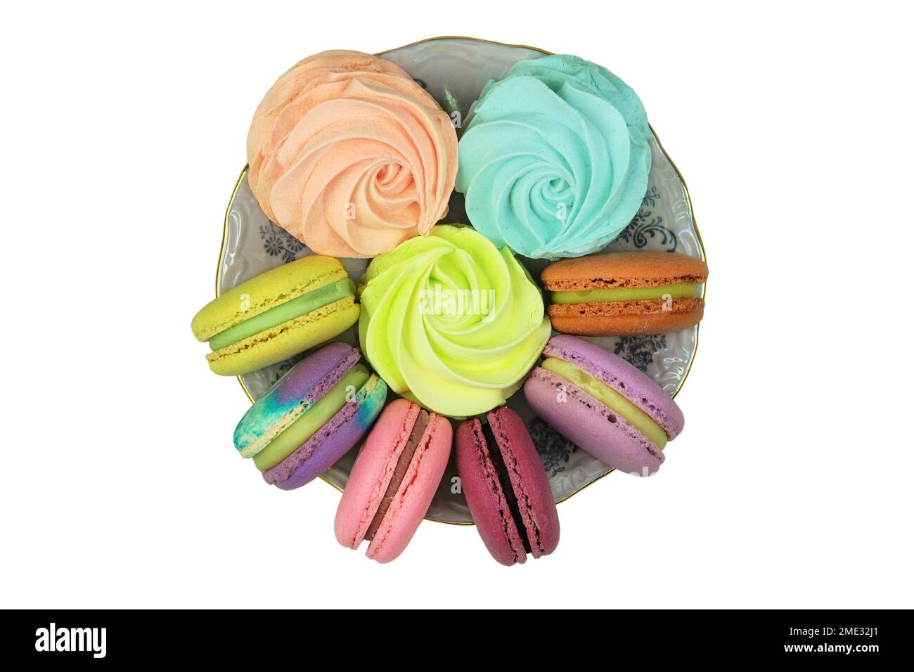 Sweet desserts in plate for the holiday. Macaroons and marshmallows ...