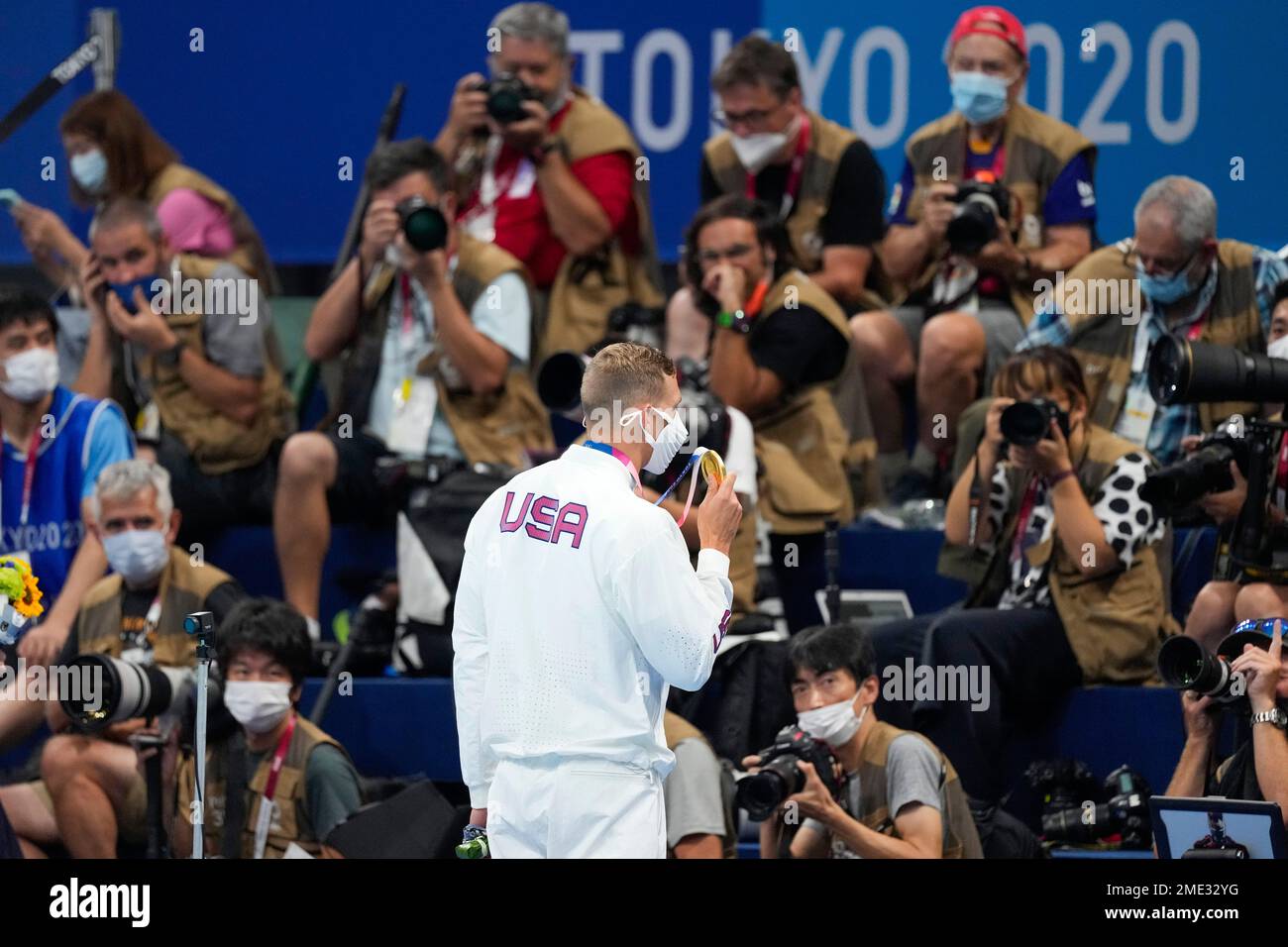 Caeleb Dressel, of the United States, poses with the gold medal after ...