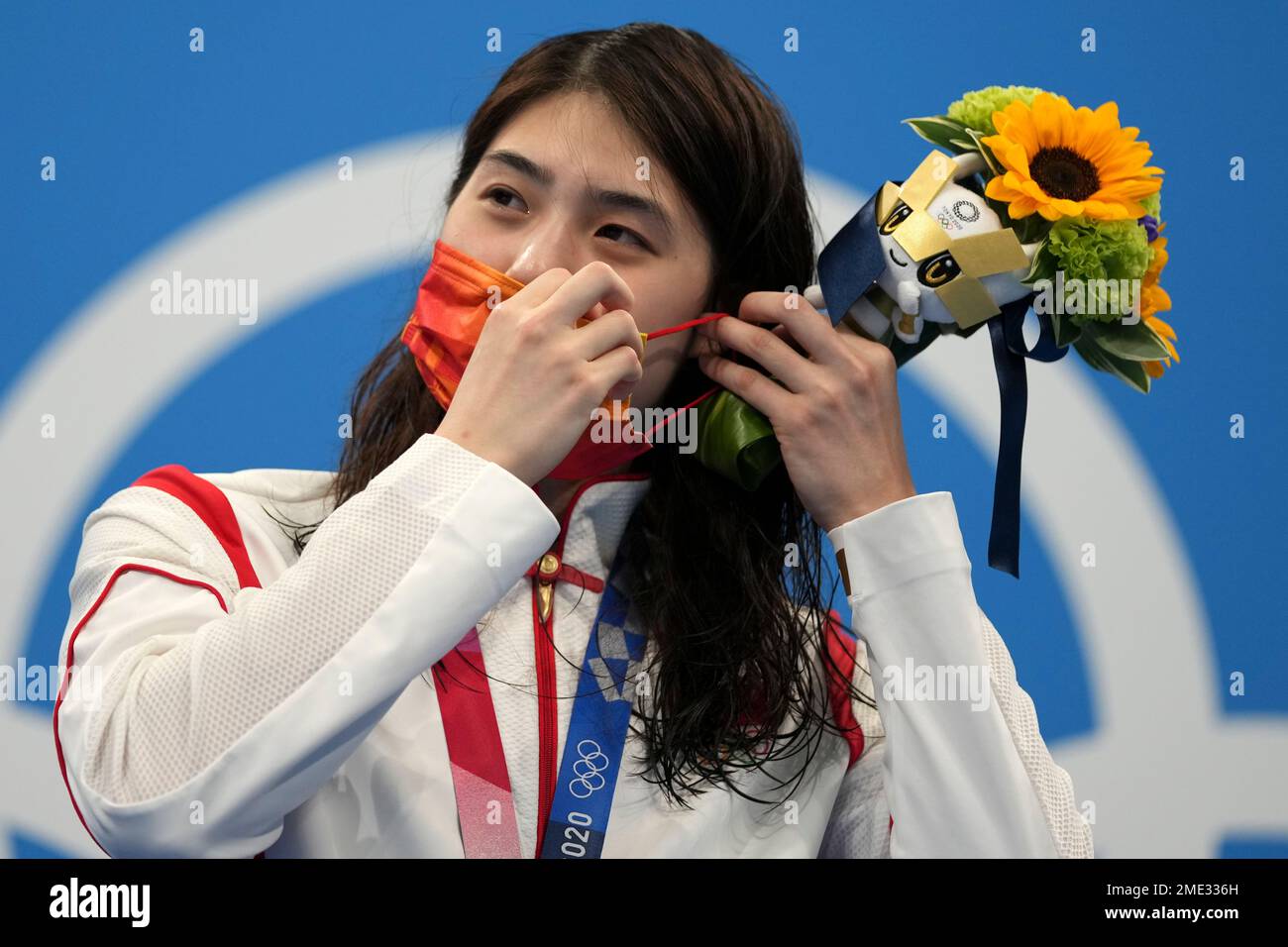 Zhang Yufei of China places her mask back on after receiving her gold ...