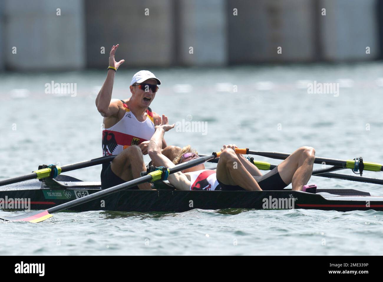Jonathan Rommelmann and Jason Osborne, of Germany react after competing ...