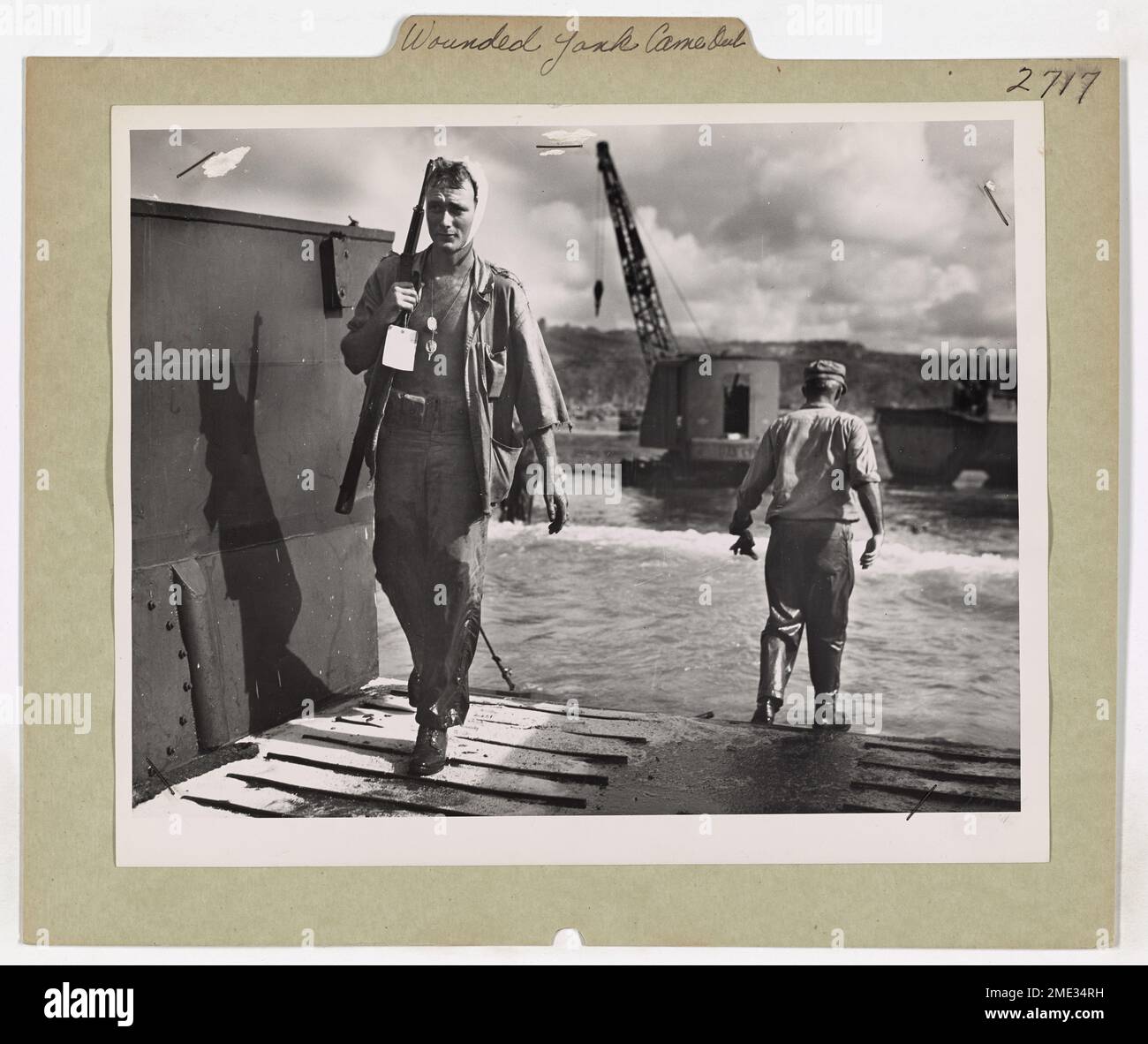 A wounded American soldier walks onto a Coast Guard-manned invasion ...