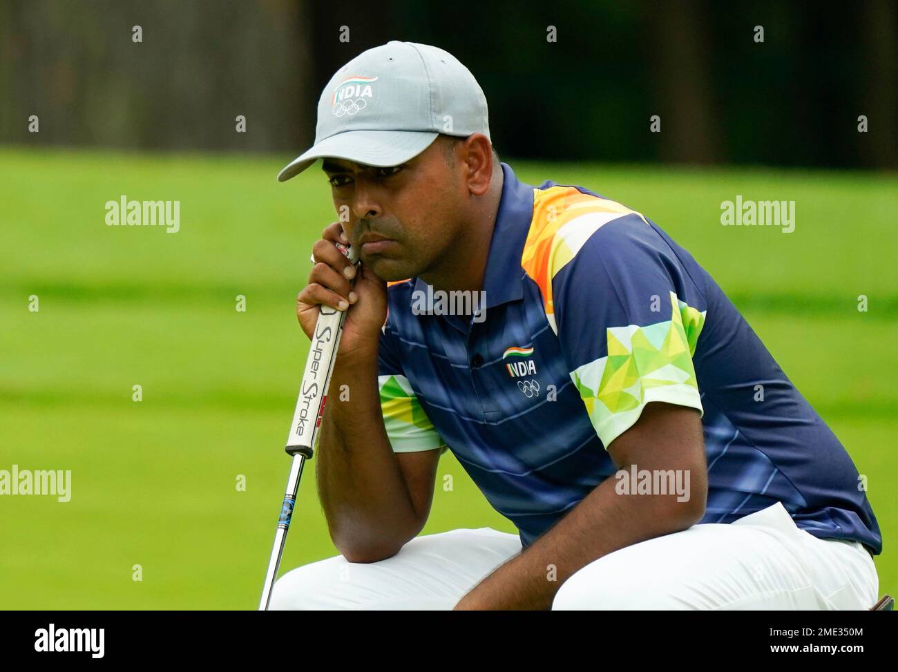 India's Anirban Lahiri studies his putt on the fourth green during the ...