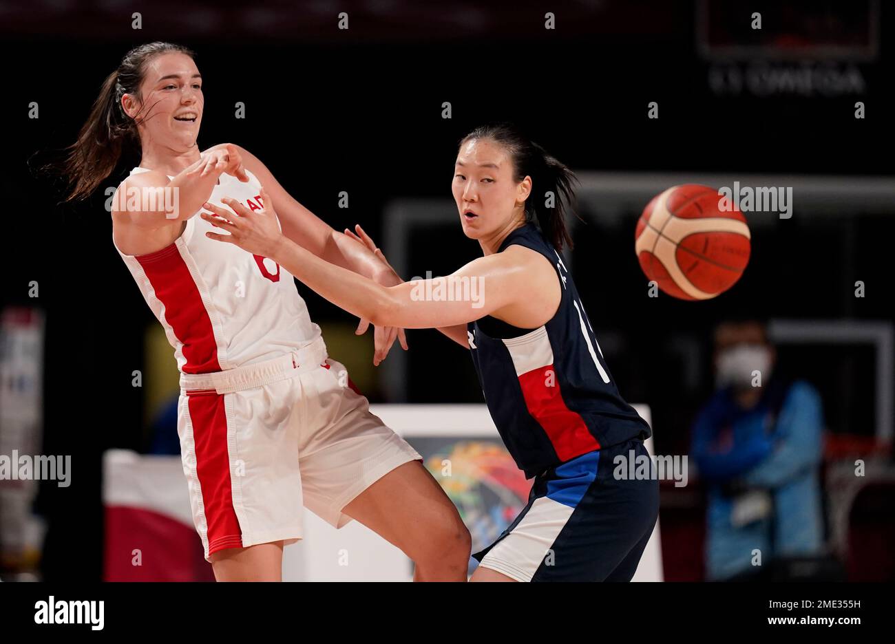 Canada's Bridget Carleton (6), left, passes around South Korea's ...