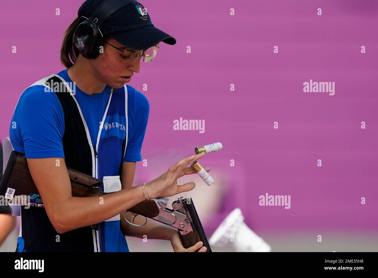 Jessica Rossi, of Italy, ejects her shells as she competes in the women ...