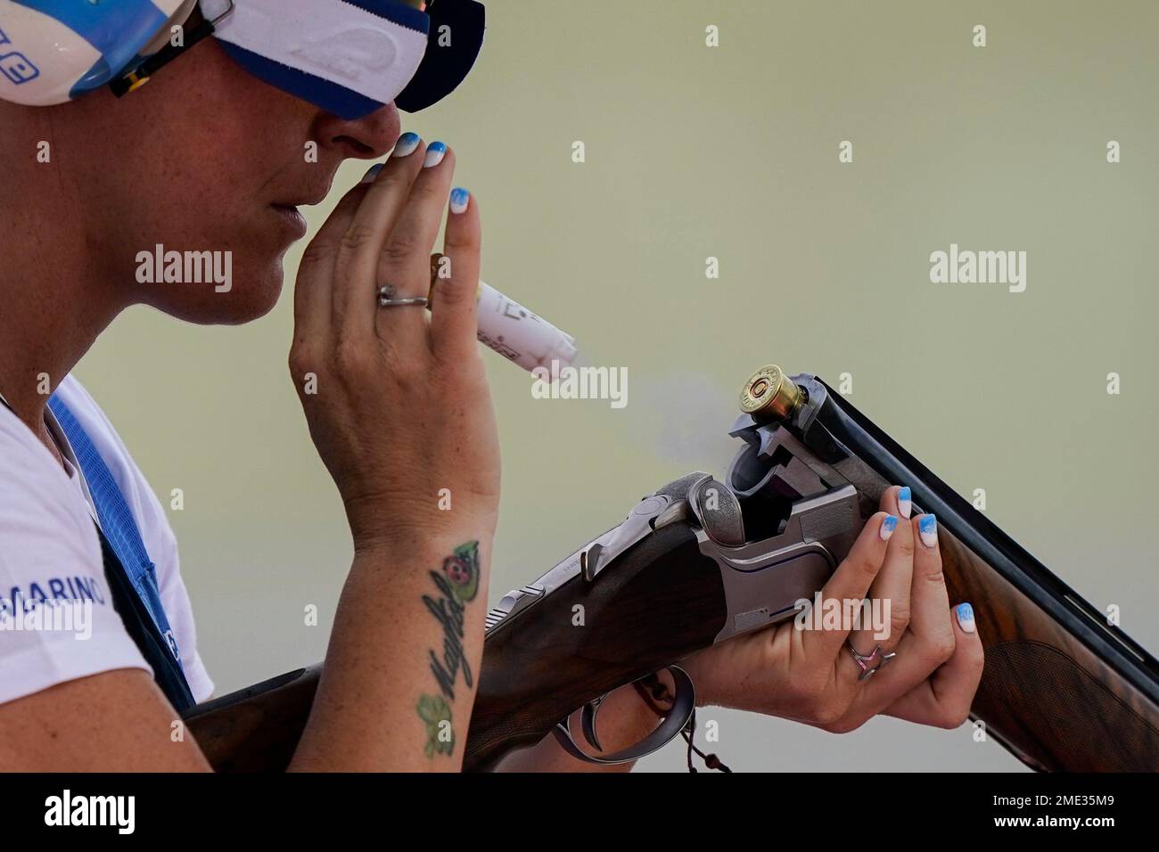 Alessandra Perilli, of San Marino, ejects her shells as she competes in ...