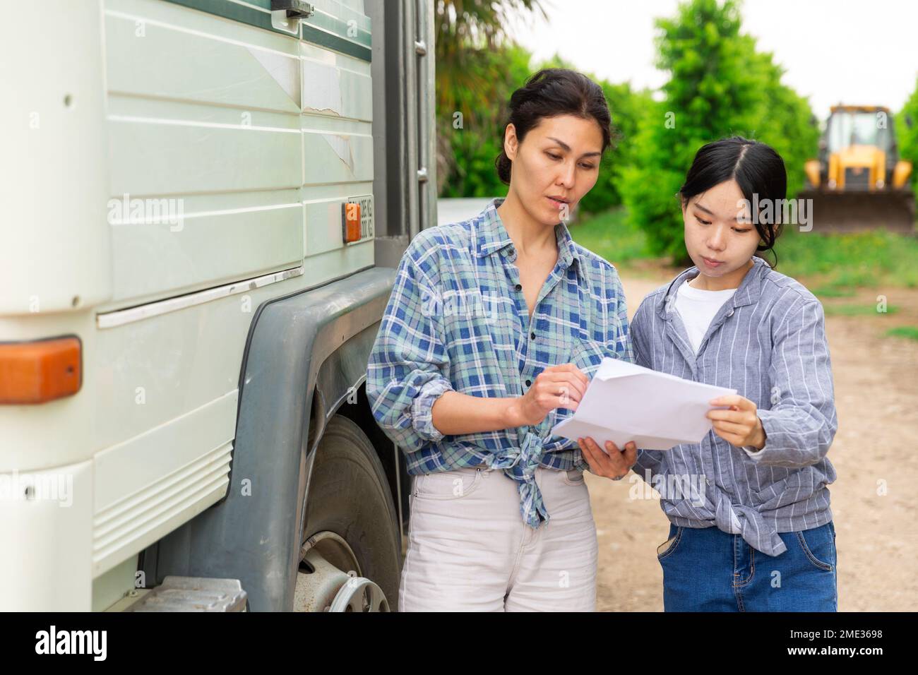 Asian female worker speaking hi-res stock photography and images - Alamy