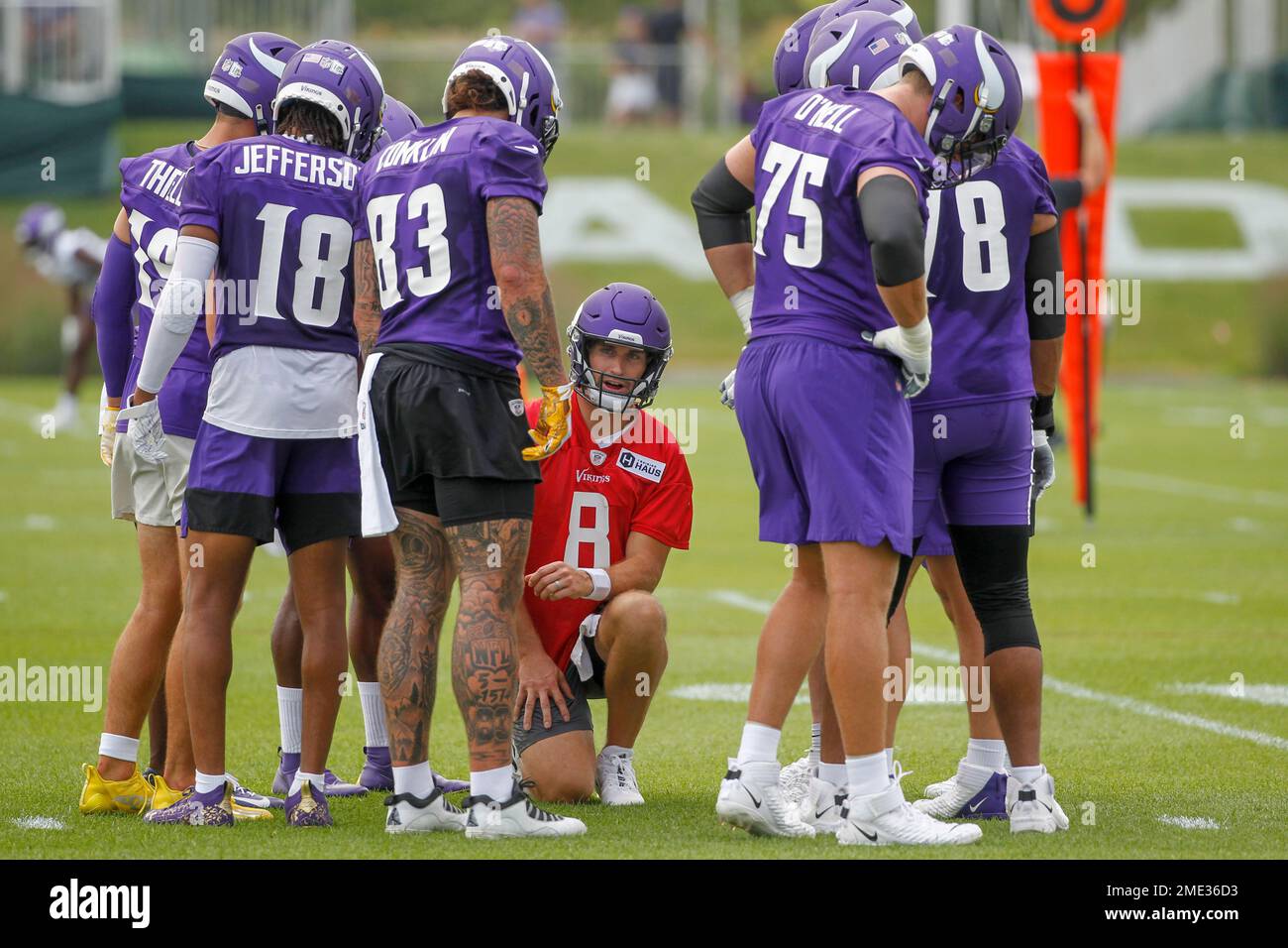 Minnesota Vikings quarterback Kirk Cousins (8) and teammates huddle ...