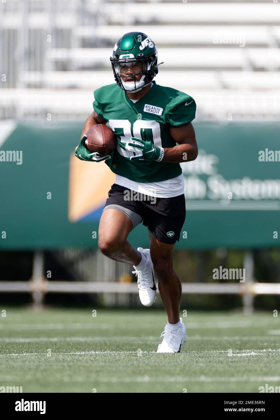 New York Jets cornerback Michael Carter II (30) runs drills during NFL ...