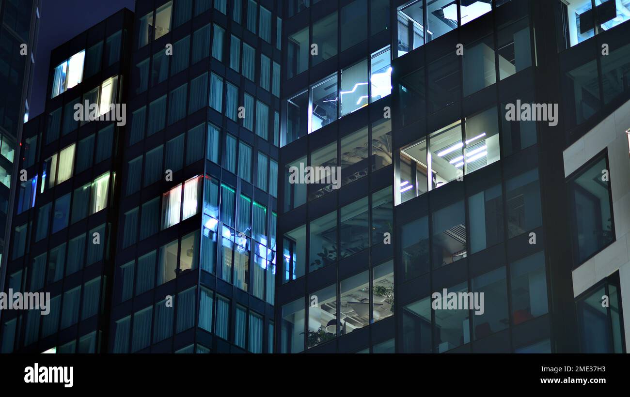 Modern office building in city at the night. View on illuminated ...