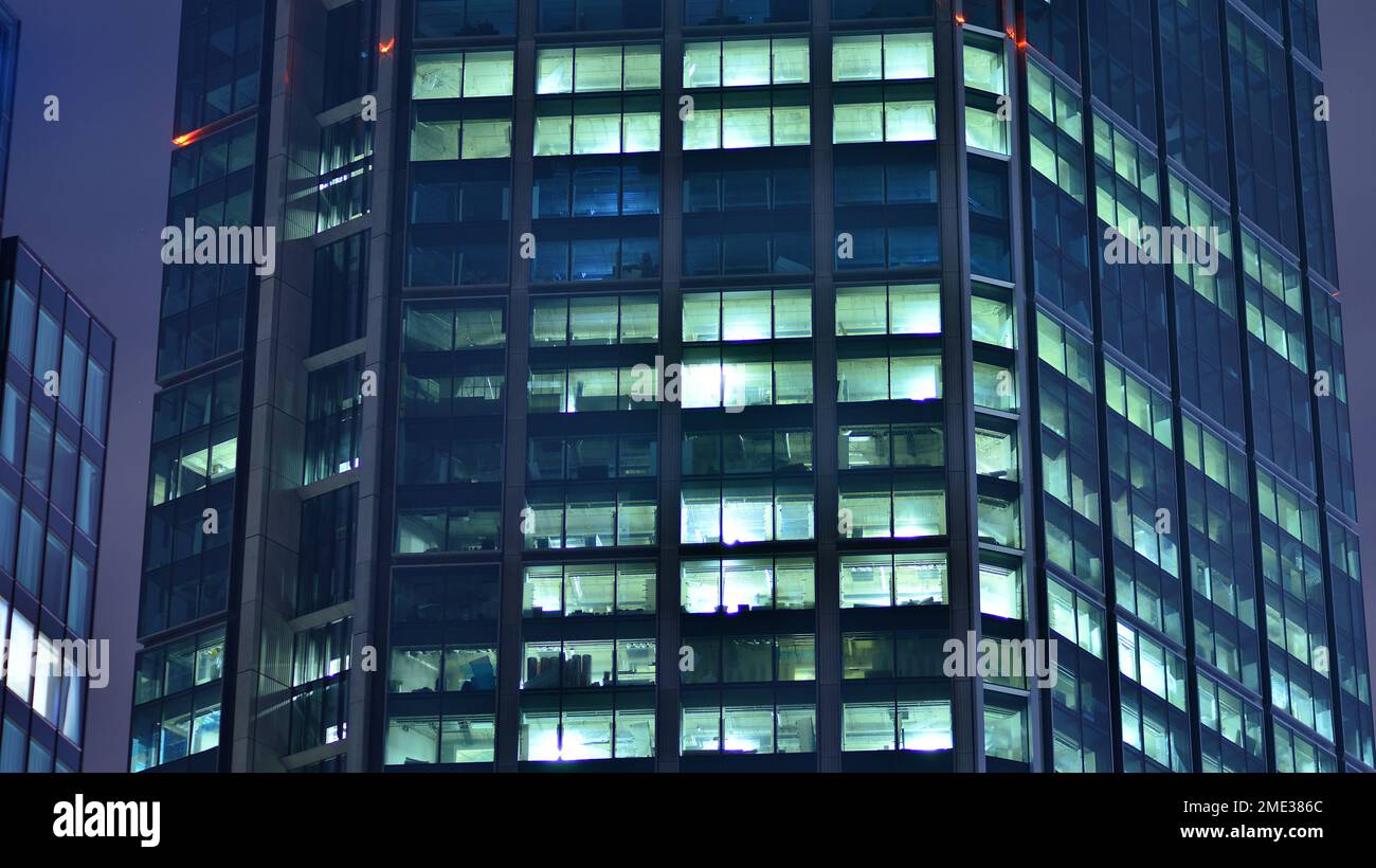 Modern office building in city at the night. View on illuminated ...