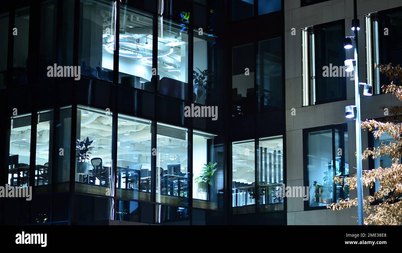 Modern office building in city at the night. View on illuminated ...