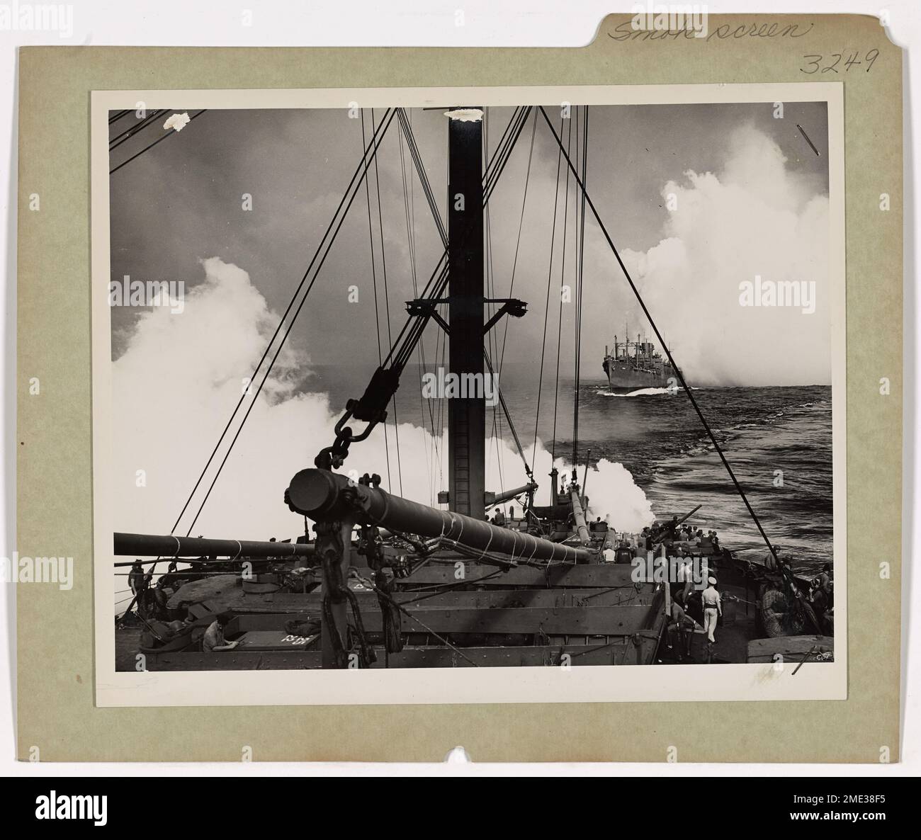 A Coast Guard-manned combat transport deploys a smoke screen to conceal ...