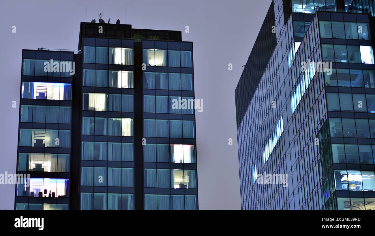 Modern office building in city at the night. View on illuminated ...