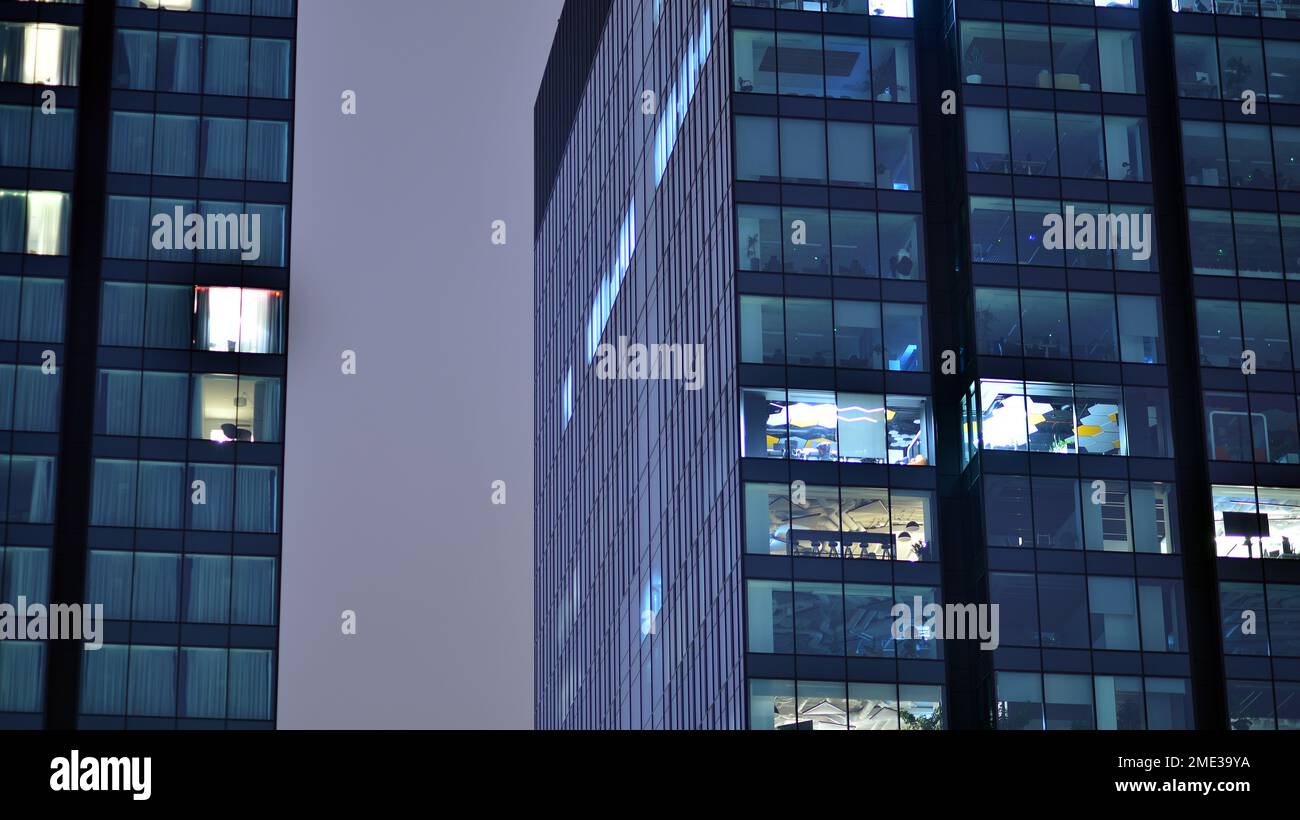 Modern office building in city at the night. View on illuminated ...