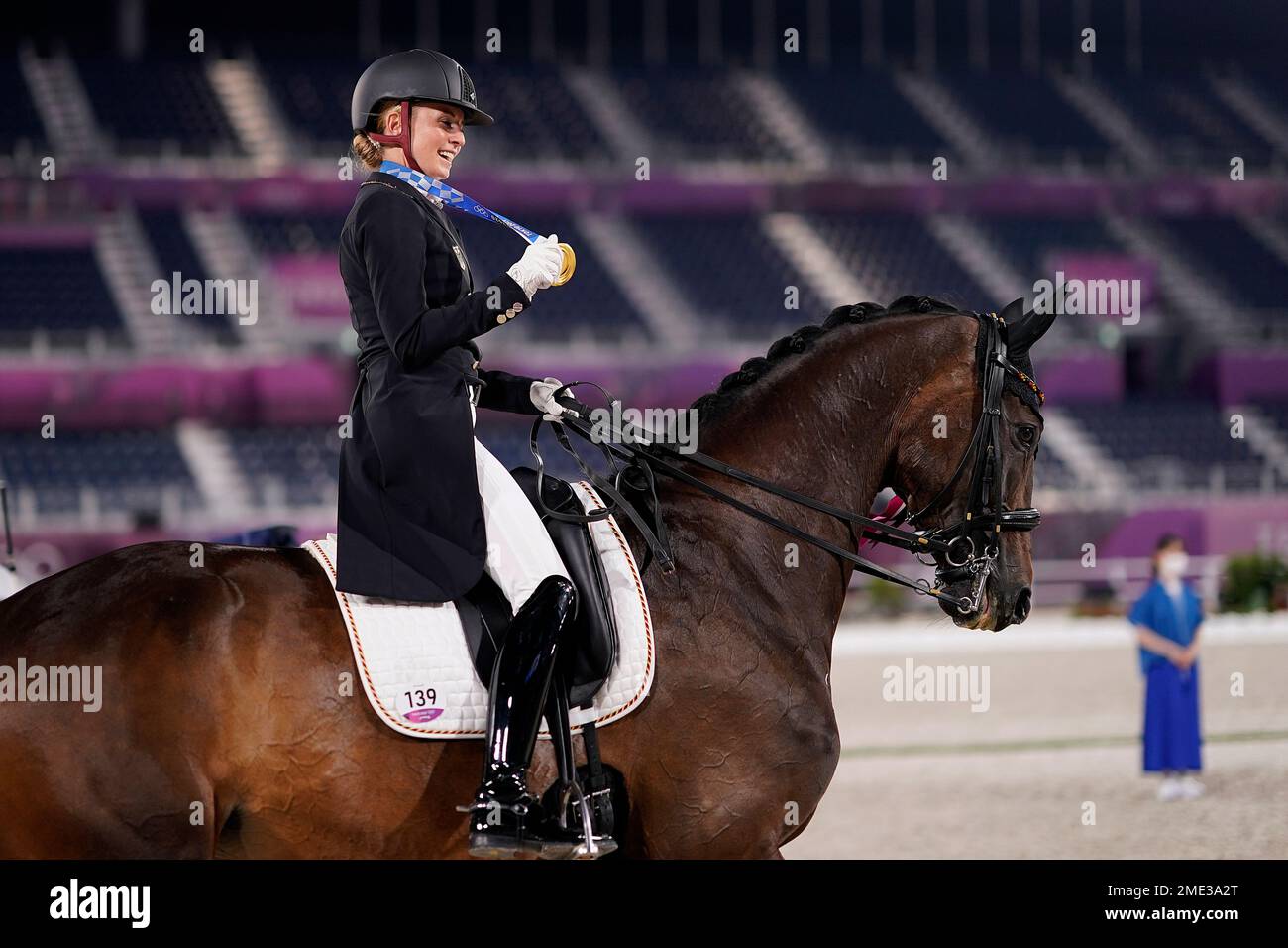 Germany's Jessica von Bredow-Werndl, riding TSF Dalera, shows off her ...