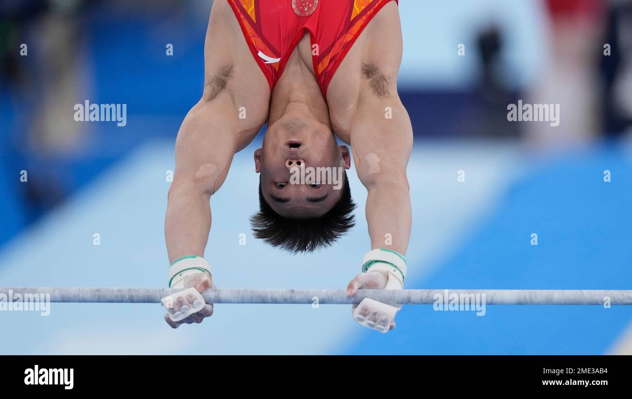 Sun Wei, of China, performs on the horizontal bar during the artistic ...