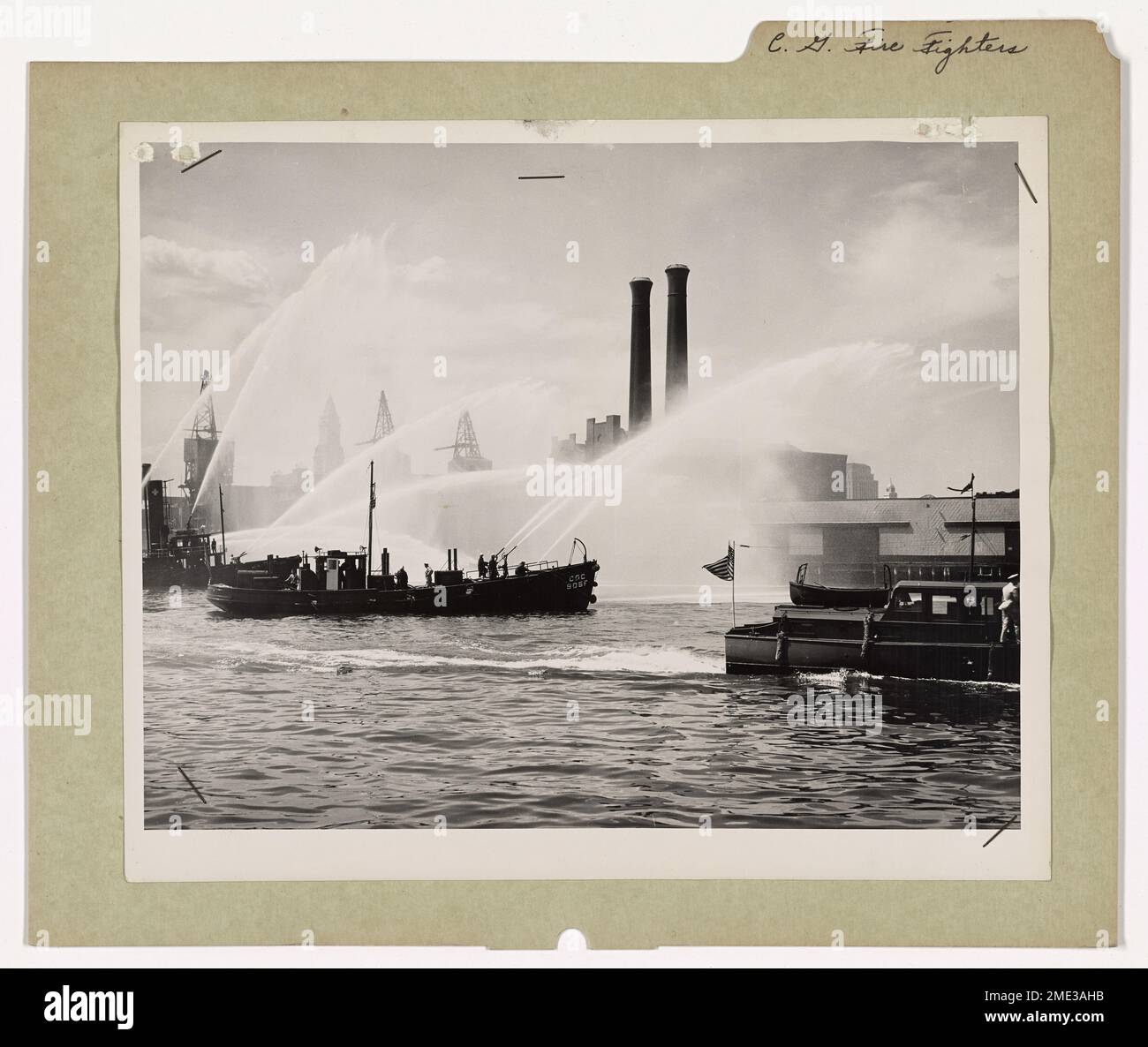 This image depicts several Coast Guard personnel operating high ...