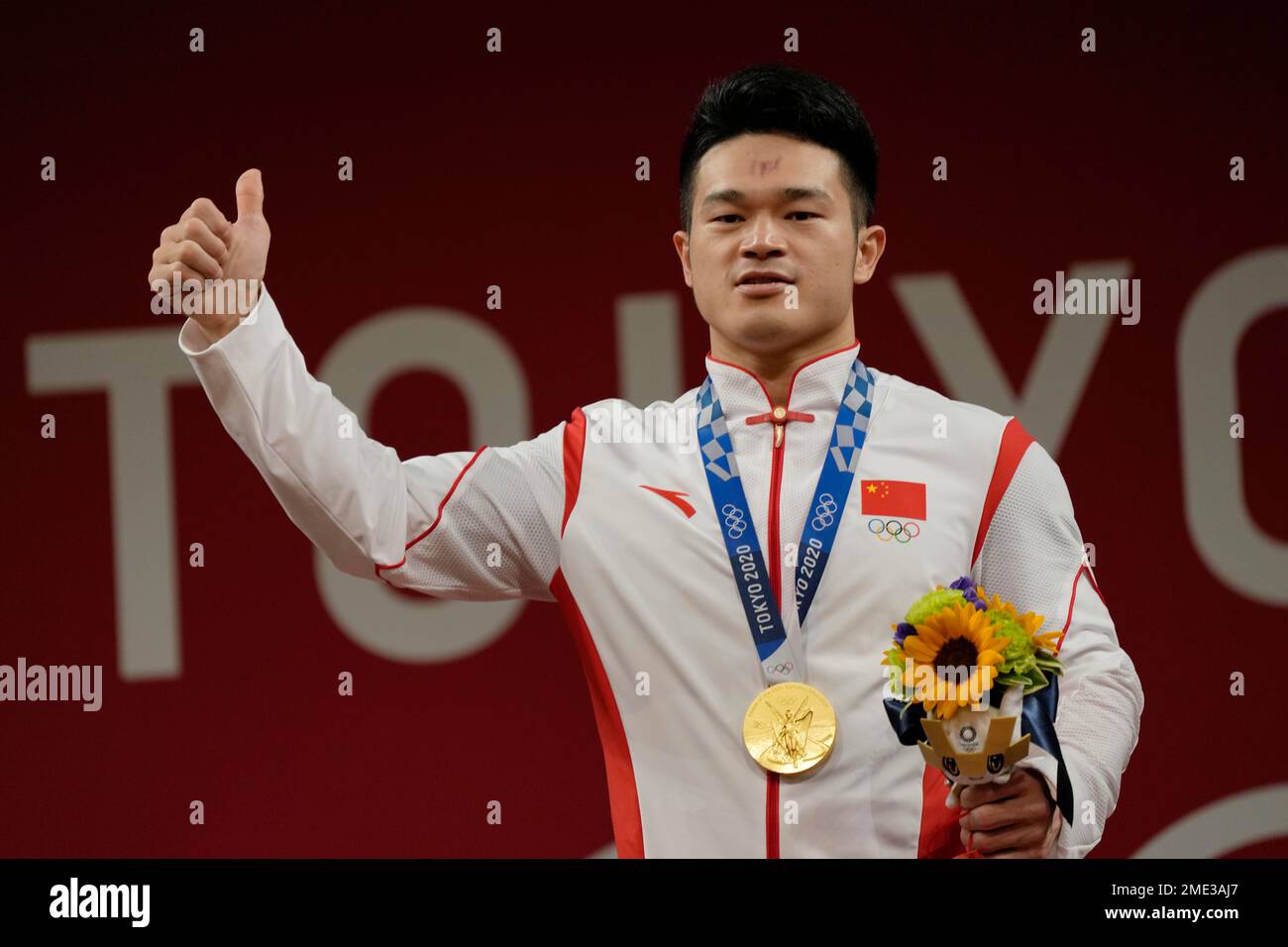 Shi Zhiyong of China celebrates on the podium after winning the gold ...