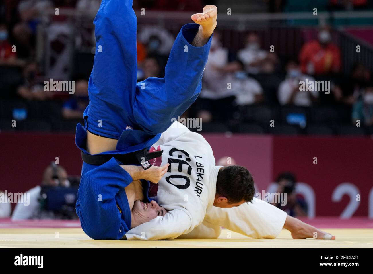 Lasha Bekauri of Georgia, right, and Eduard Trippel of Germany compete ...