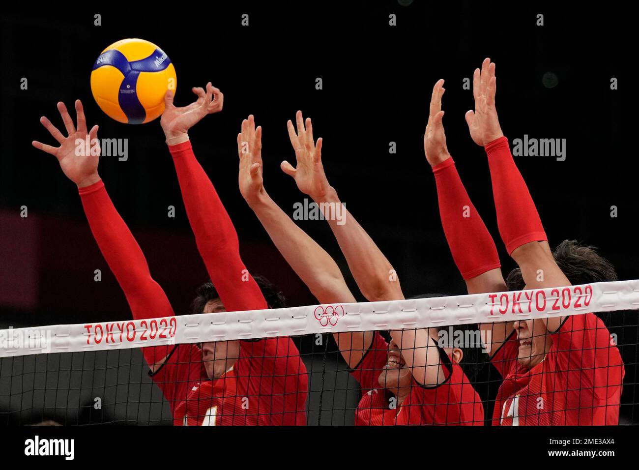 Japan's Yuki Ishikawa, left, Haku Ri and Yuji Nishida, fail to block a ...