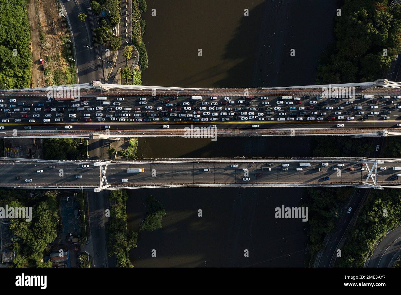 Commuters cross the Juan Pablo Duarte Bridge in Santo Domingo ...
