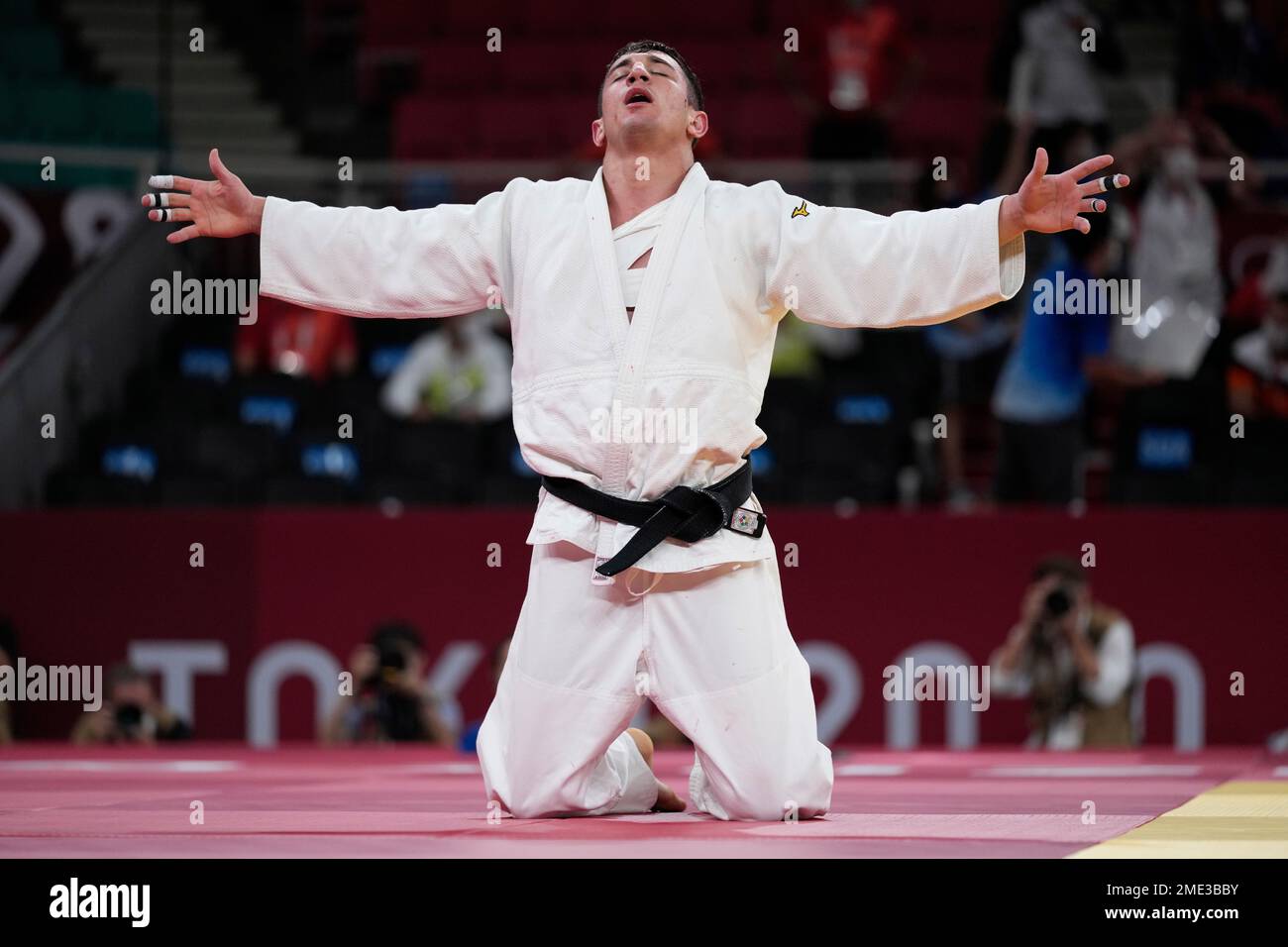 Lasha Bekauri of Georgia, left, reacts after defeating Eduard Trippel ...