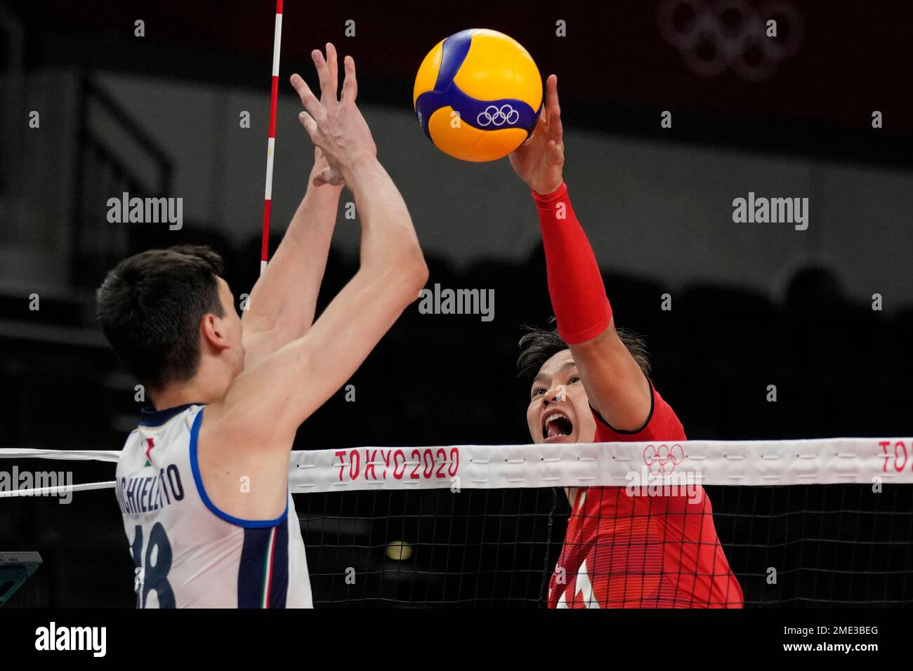 Japan's Yuji Nishida spikes a ball against Italy's Alessandro ...