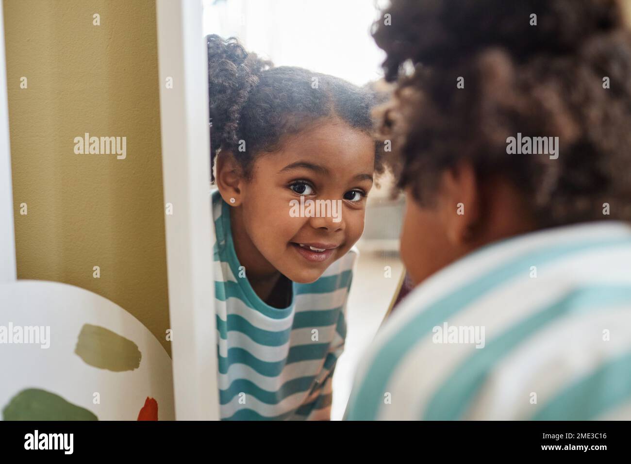 Child Looking In Mirror