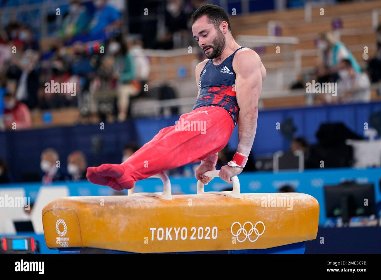 James Hall, of Britain, performs on the pommel horse during the ...