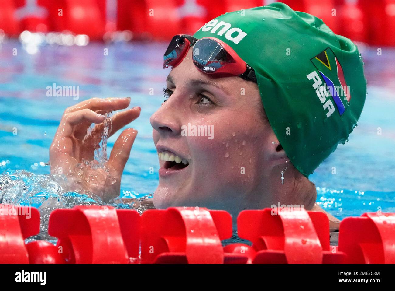 Kaylene Corbett, of South Africa, reacts after winning a heat in the ...
