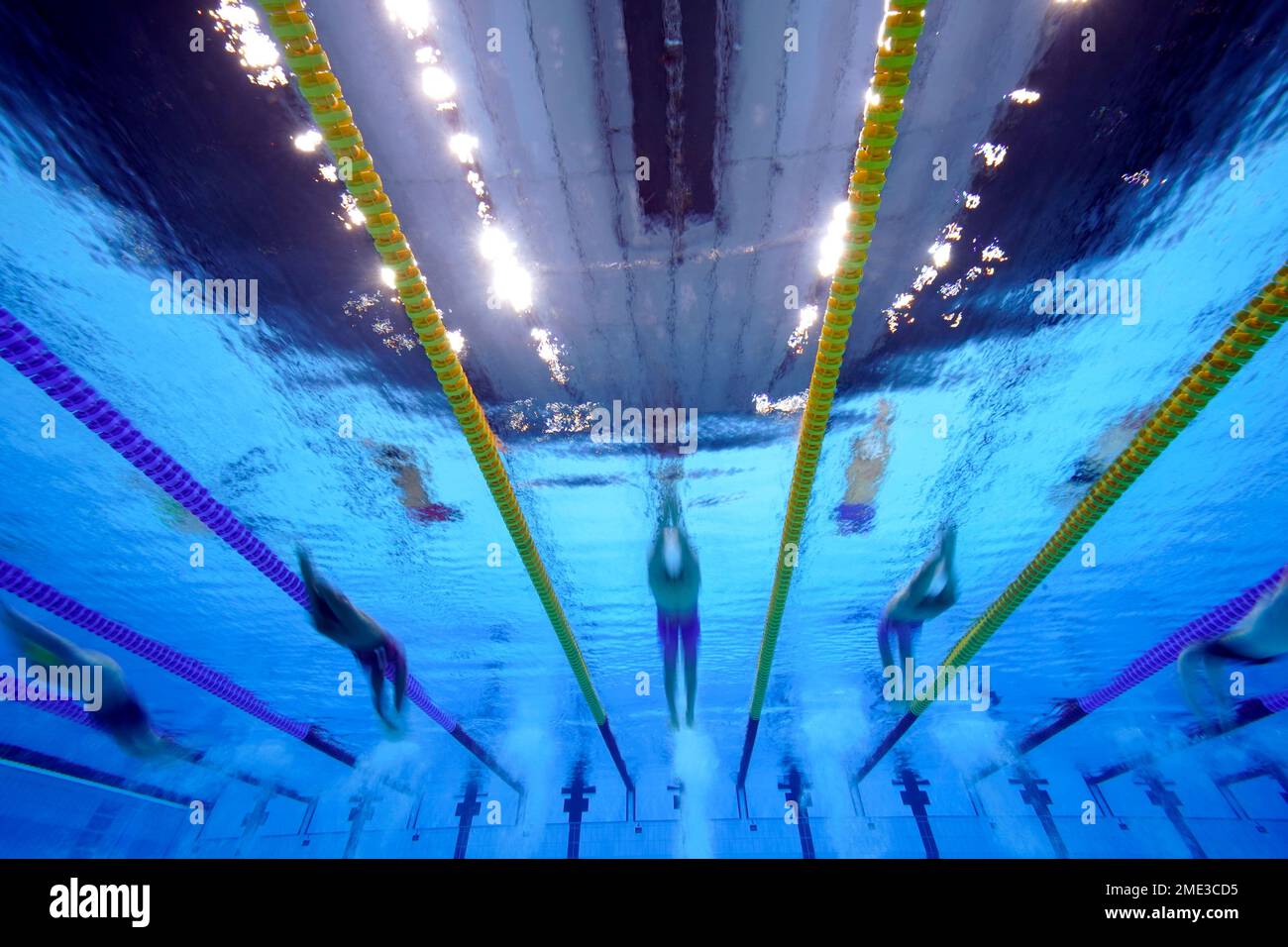 Swimmers compete in a men's 200-meter backstroke heat at the 2020 ...