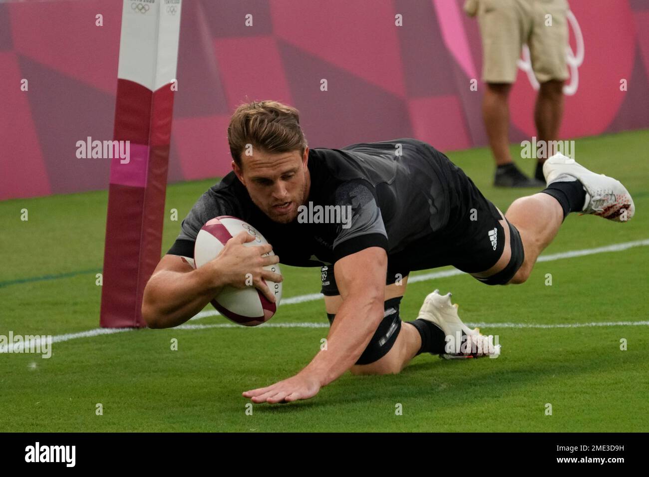New Zealand's Scott Curry scores a try against Fiji, in the men's rugby ...