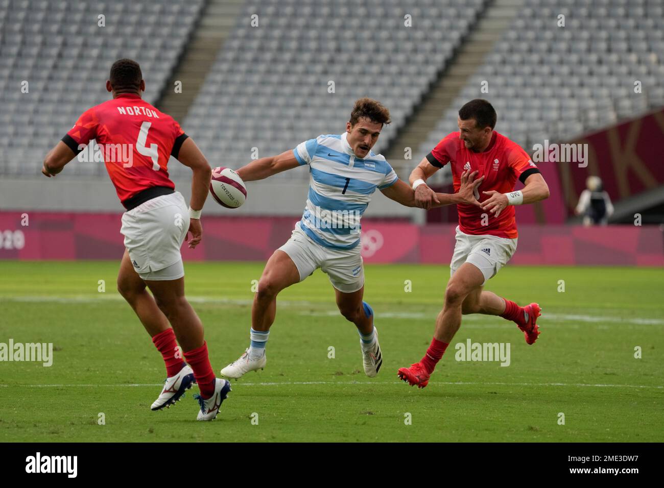 Argentina's Rodrigo Isgro holds off Britain's Alex Davis, as Britain's ...