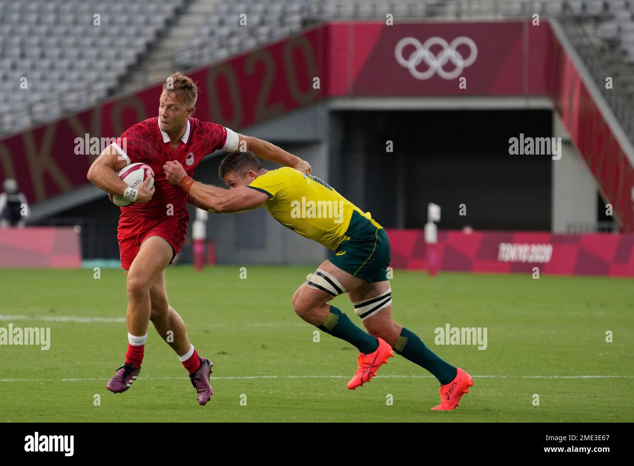 Canada's Harry Jones, left, comes under pressure from Australia's Nick ...