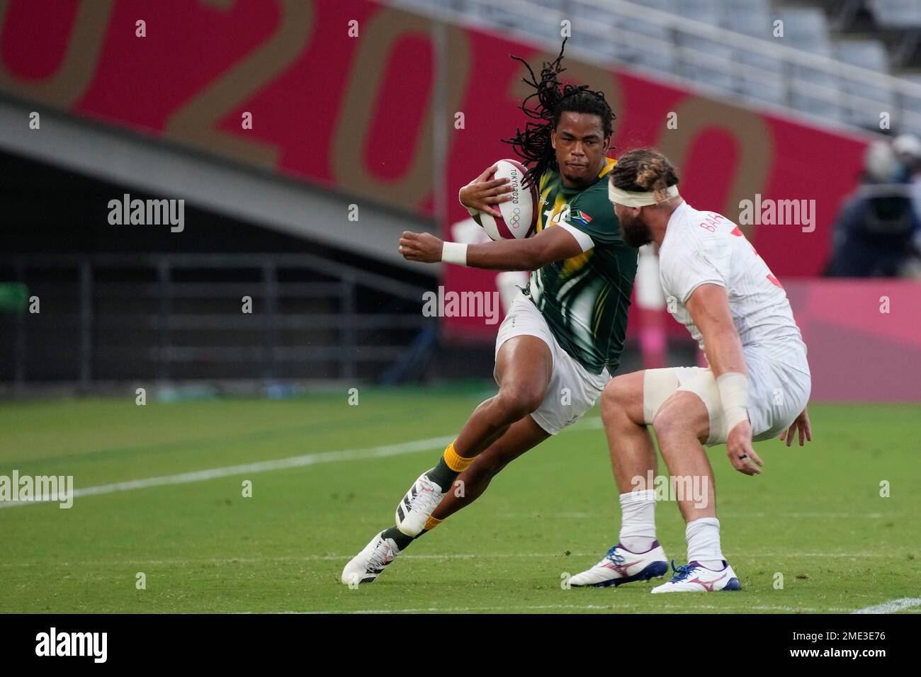 South Africa's Stedman Gans tries to evade Danny Barrett of the United ...