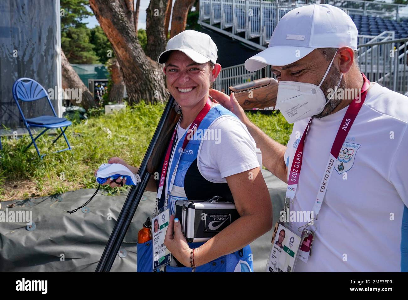 Alessandra Perilli, of San Marino, smiles as she walks with her coach ...