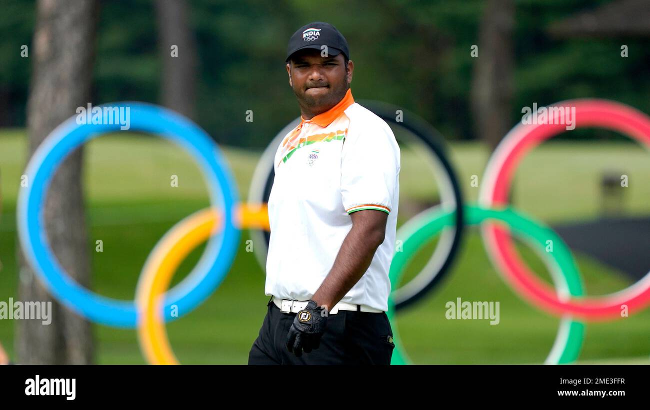Udayan Mane, of India, walks across the putting green during a practice ...