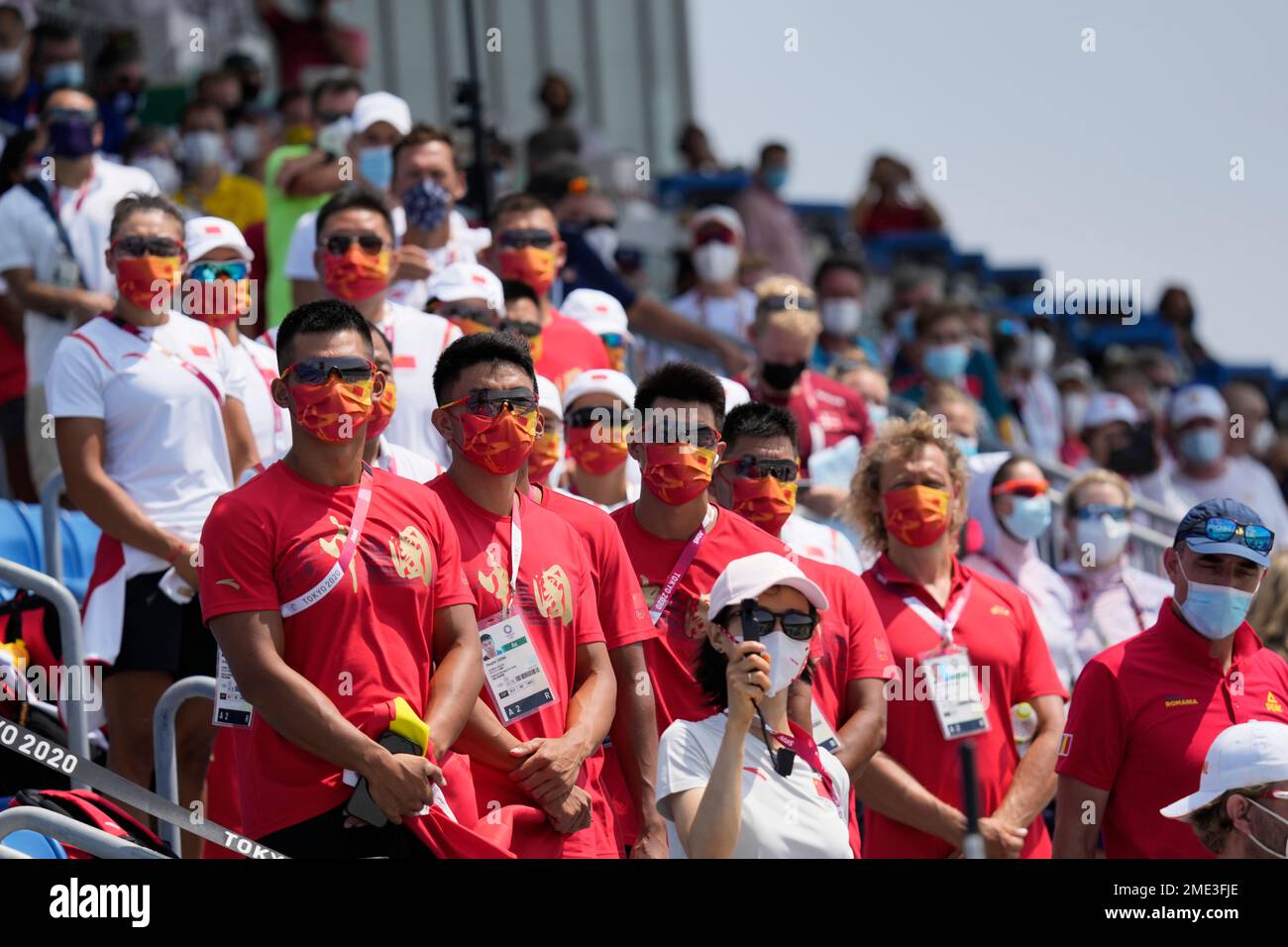 Team members of China attend at the medal ceremony for the men's rowing ...