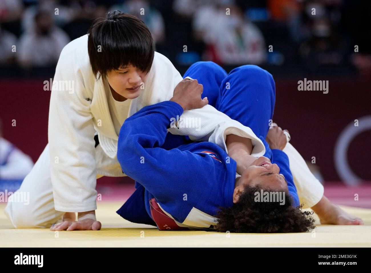Chizuru Arai of Japan, left, and Maria Perez of Puerto Rico compete ...