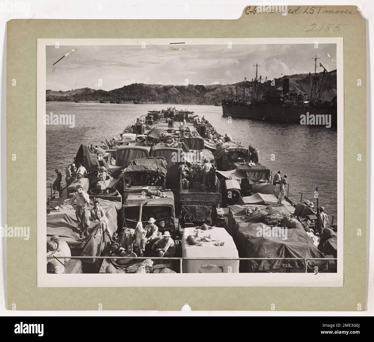 A Coast Guard-manned Landing Ship Tank (LST) is shown entering the calm ...